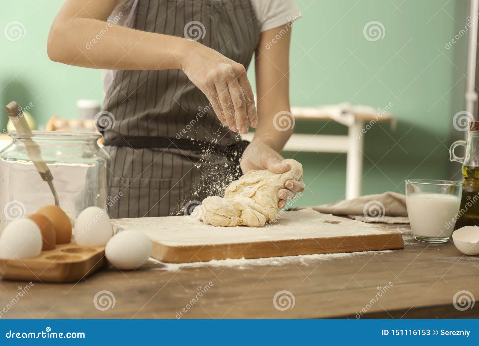 Woman Sprinkling Flour on Dough in Kitchen Stock Image - Image of ...