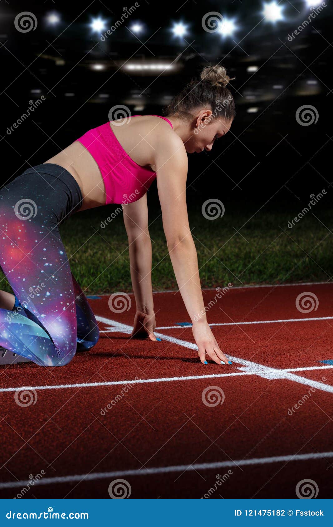 Woman Sprinter Leaving Starting Blocks on the Athletic Track. Exploding ...