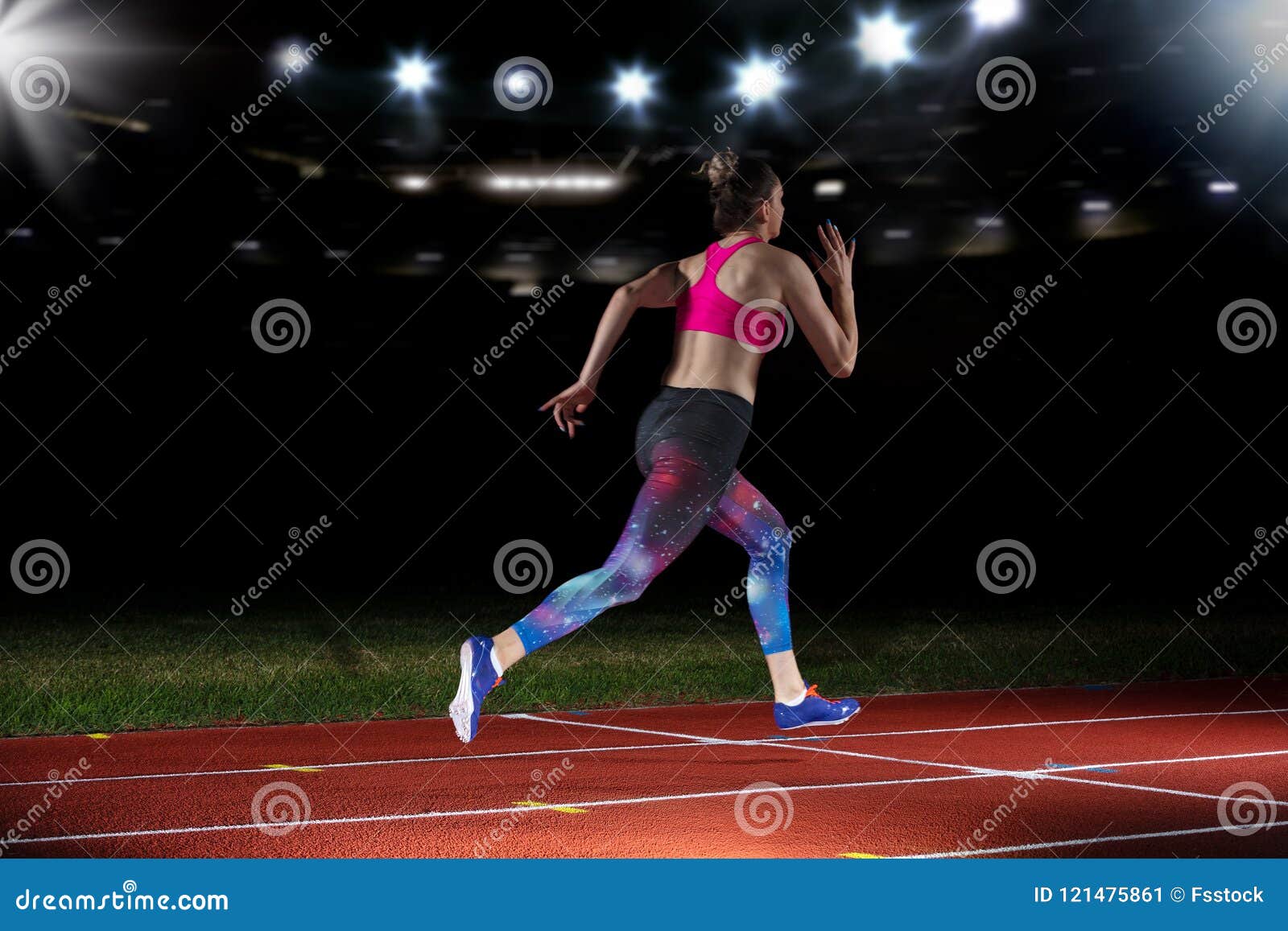 Woman Sprinter Leaving Starting Blocks on the Athletic Track. Exploding ...