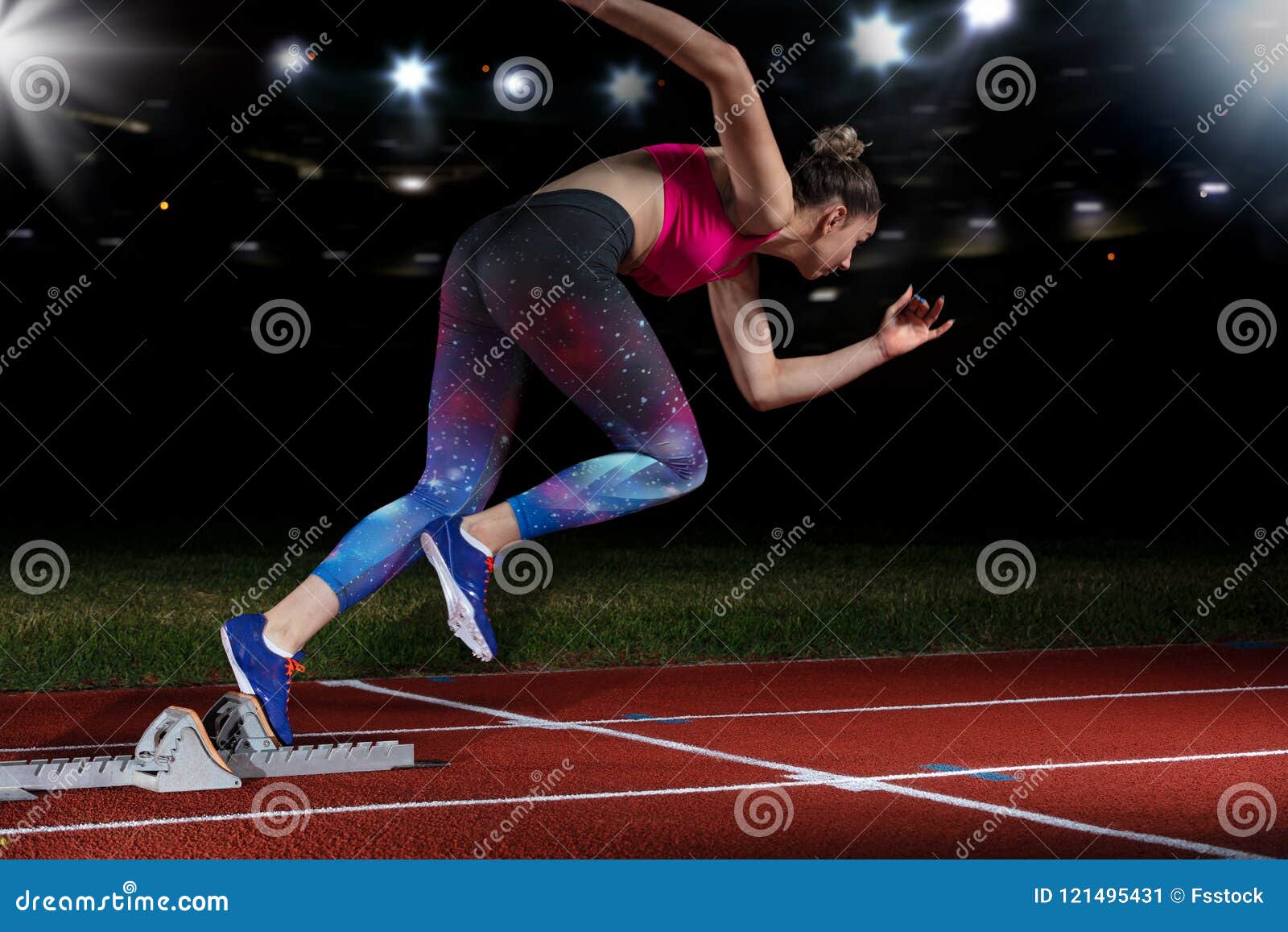 Woman Sprinter Leaving Starting Blocks on the Athletic Track. Exploding ...