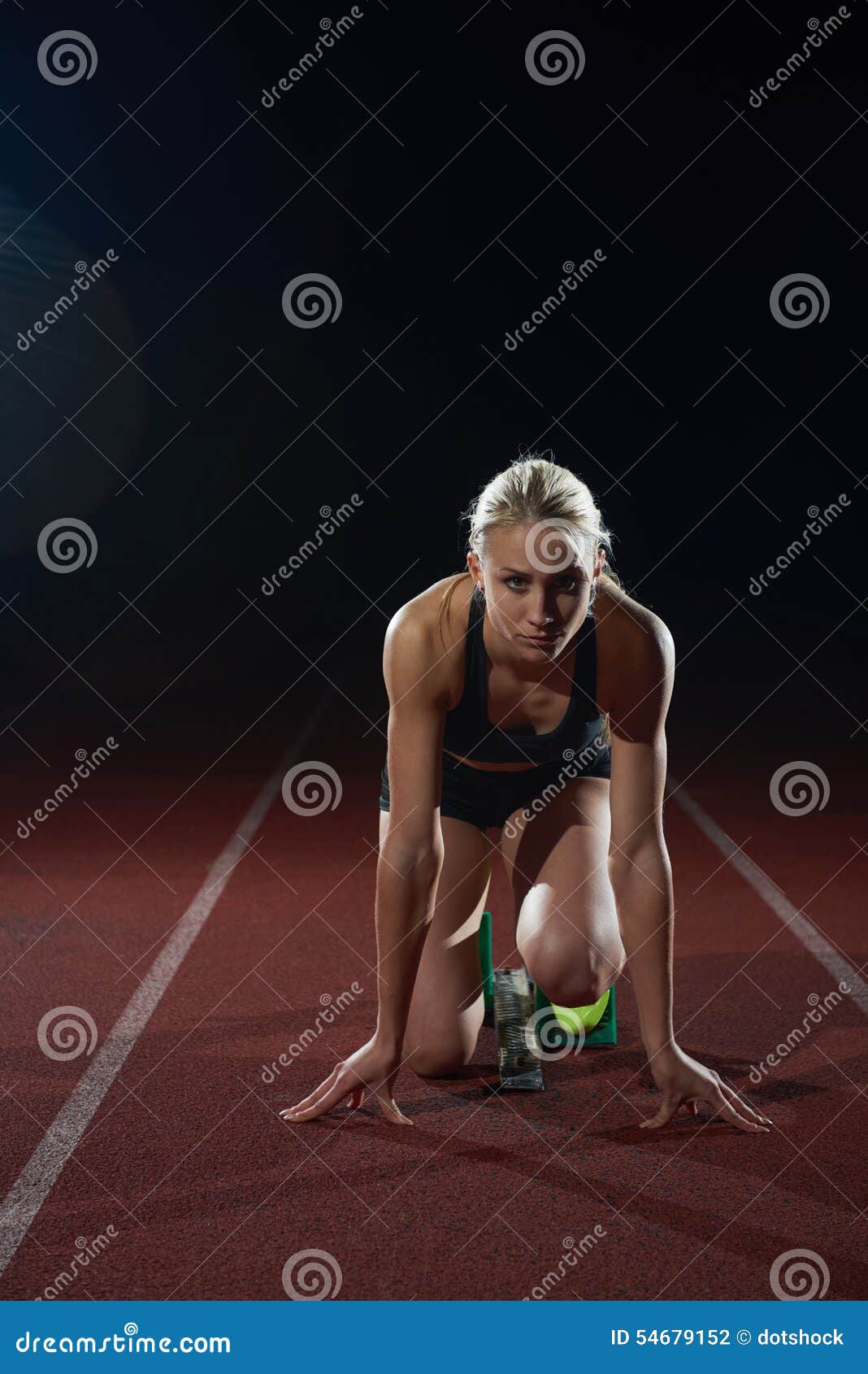 Woman Sprinter Leaving Starting Blocks Stock Photo - Image of body ...