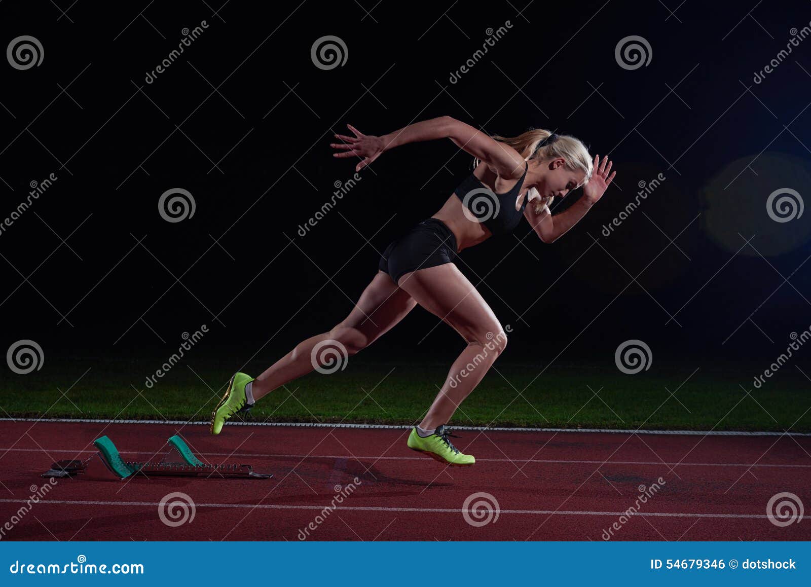 Woman Sprinter Leaving Starting Blocks Stock Photo - Image of adult ...