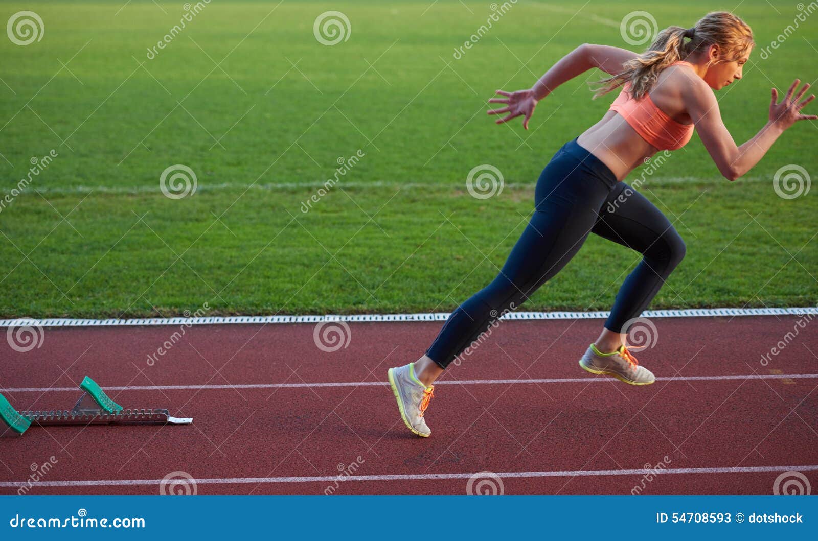 Woman Sprinter Leaving Starting Blocks Stock Image - Image of body ...