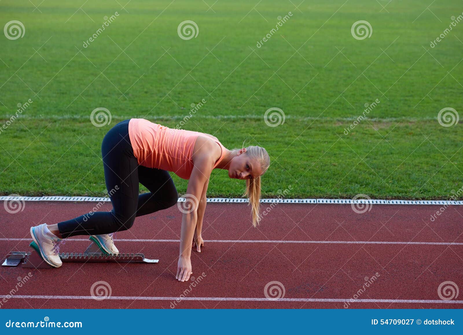 Woman Sprinter Leaving Starting Blocks Stock Image - Image of body ...