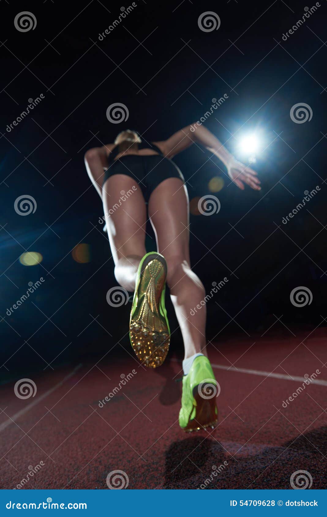 Woman Sprinter Leaving Starting Blocks Stock Photo - Image of fitness ...