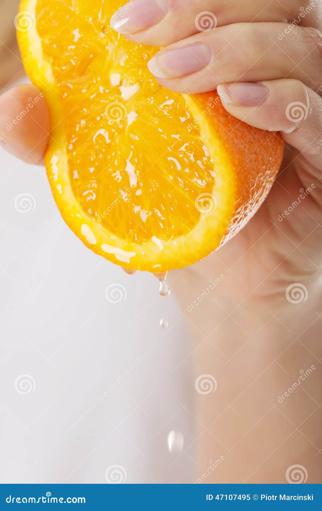 Woman Squeezing Juice from an Orange Stock Image - Image of female ...