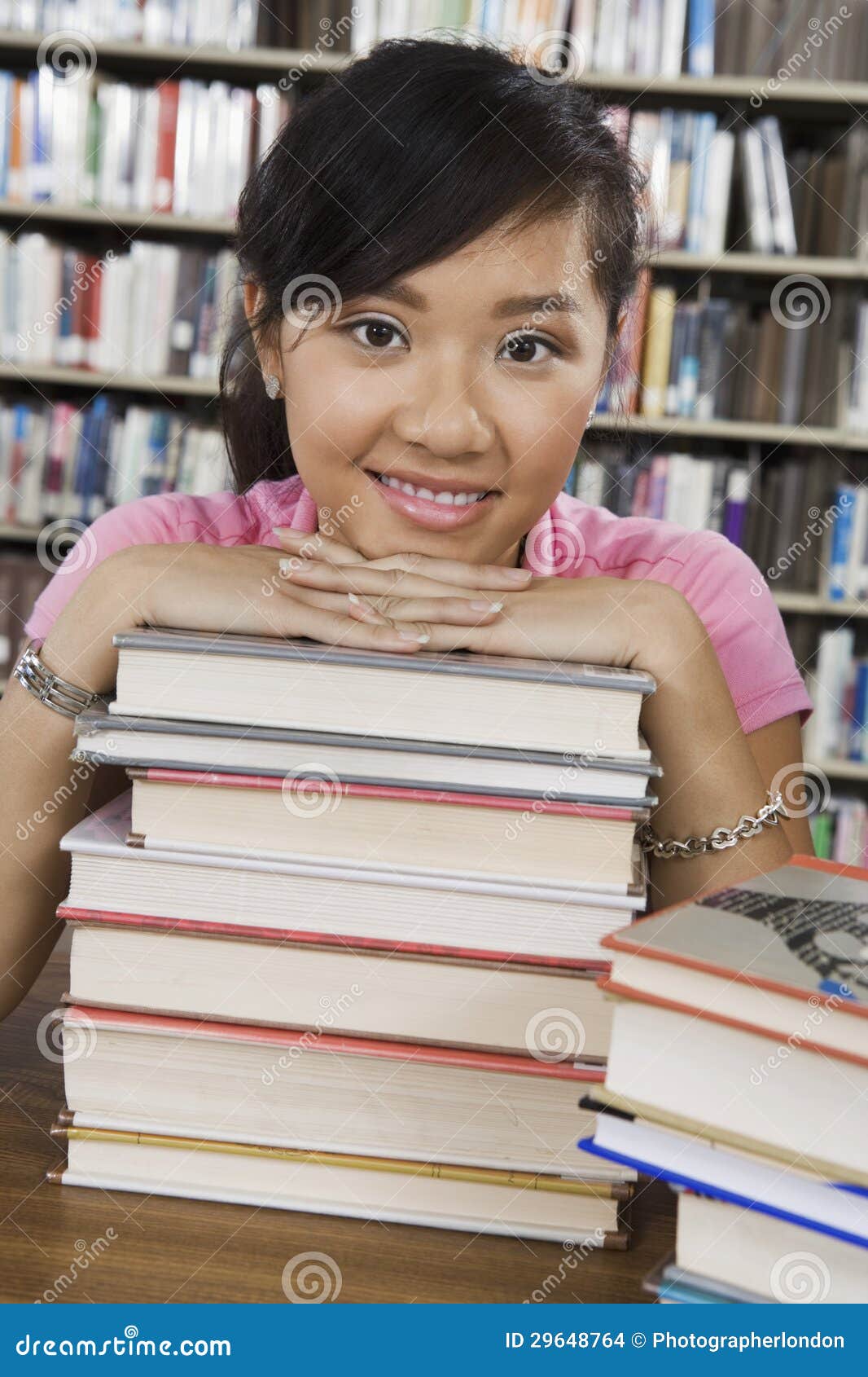 Woman with Stack of Books stock photo. Image of research - 29648764