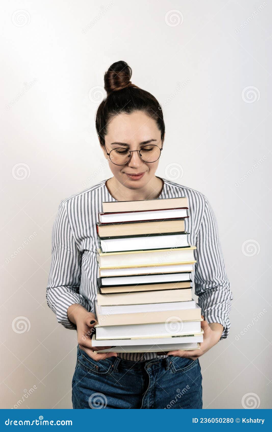 Woman with stack of books stock photo. Image of student - 236050280