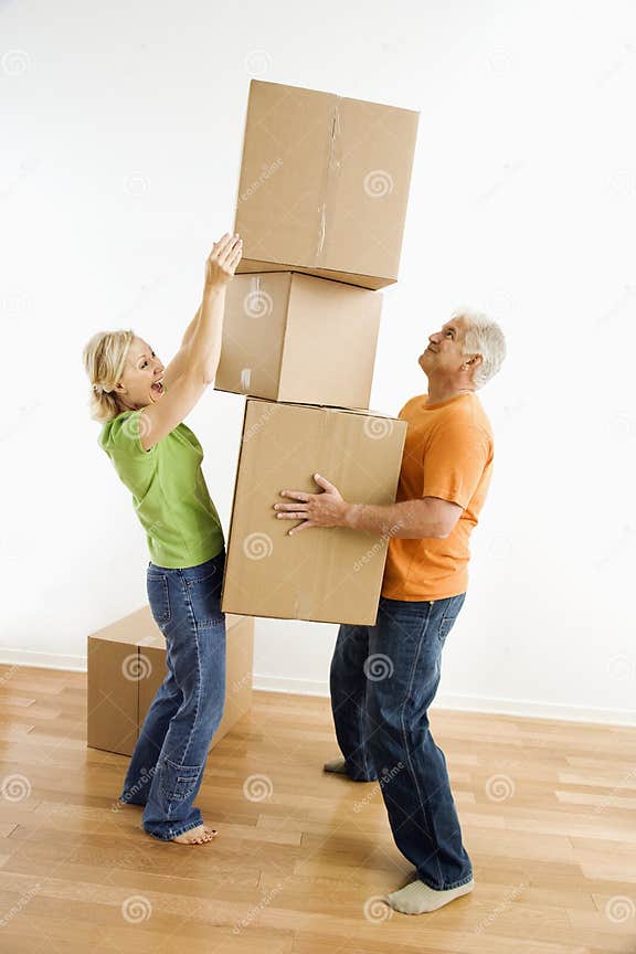 Woman stacking boxes. stock photo. Image of life, heavy - 6153496