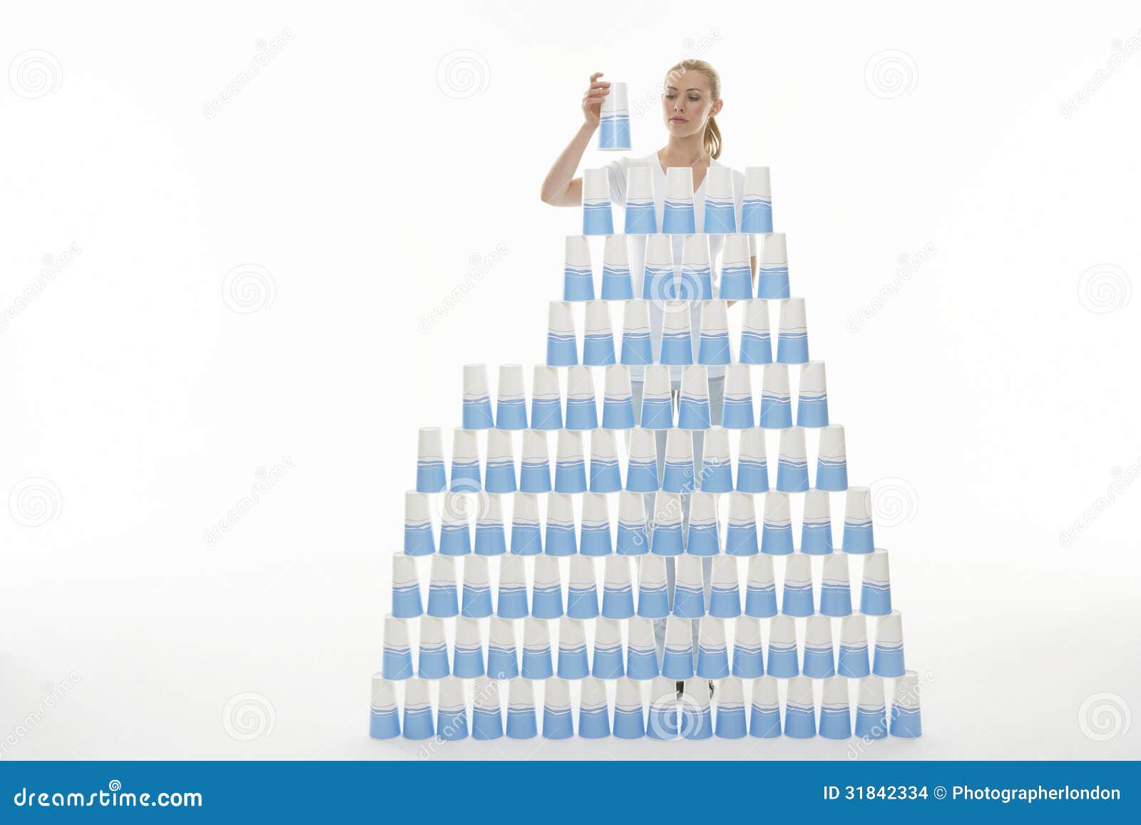 Woman Stacking Plastic Cups Into Pyramid Royalty-Free Stock Image ...