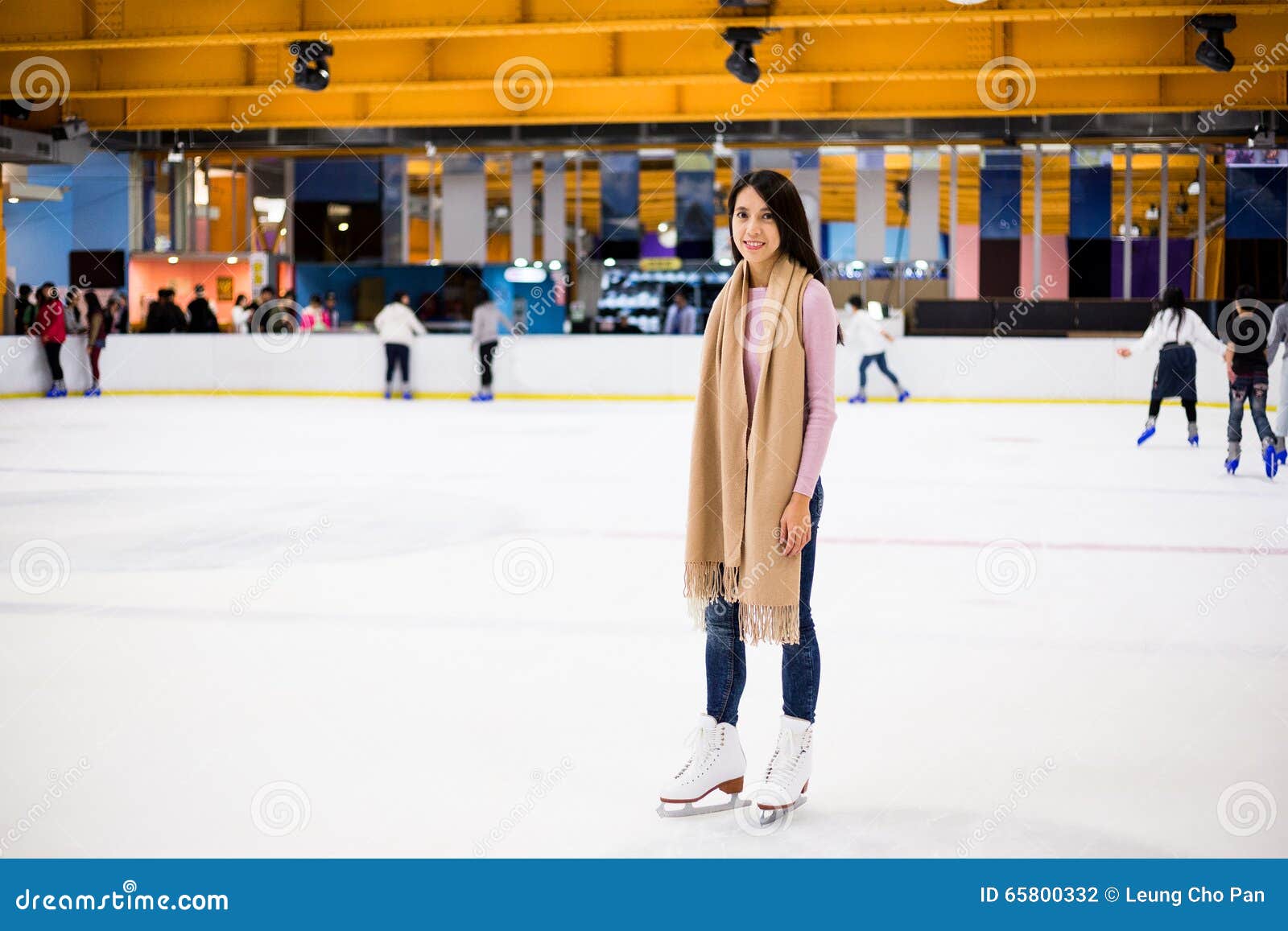 Woman stand on ice rink stock photo. Image of exercise - 65800332