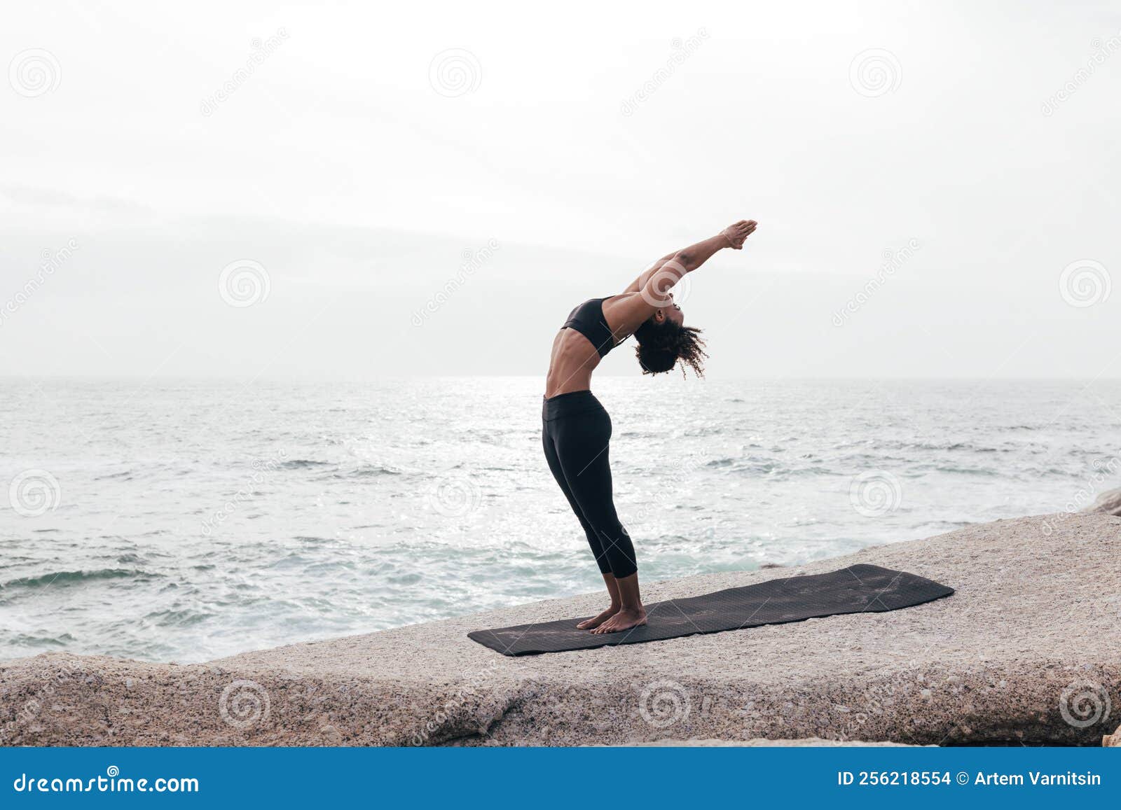 Woman in Standing Backbend Pose by Ocean Stock Photo - Image of sunset ...