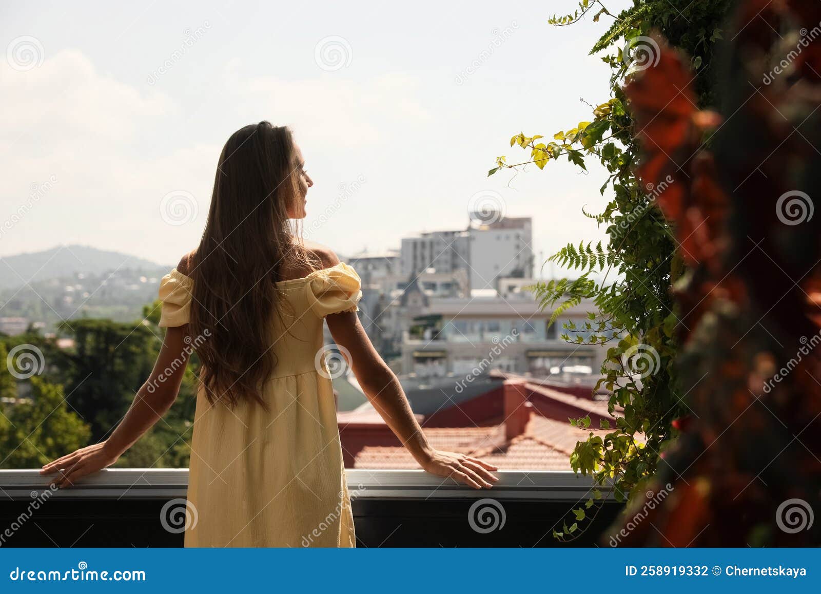Young Woman Standing on Balcony, Back View. Space for Text Stock Photo ...