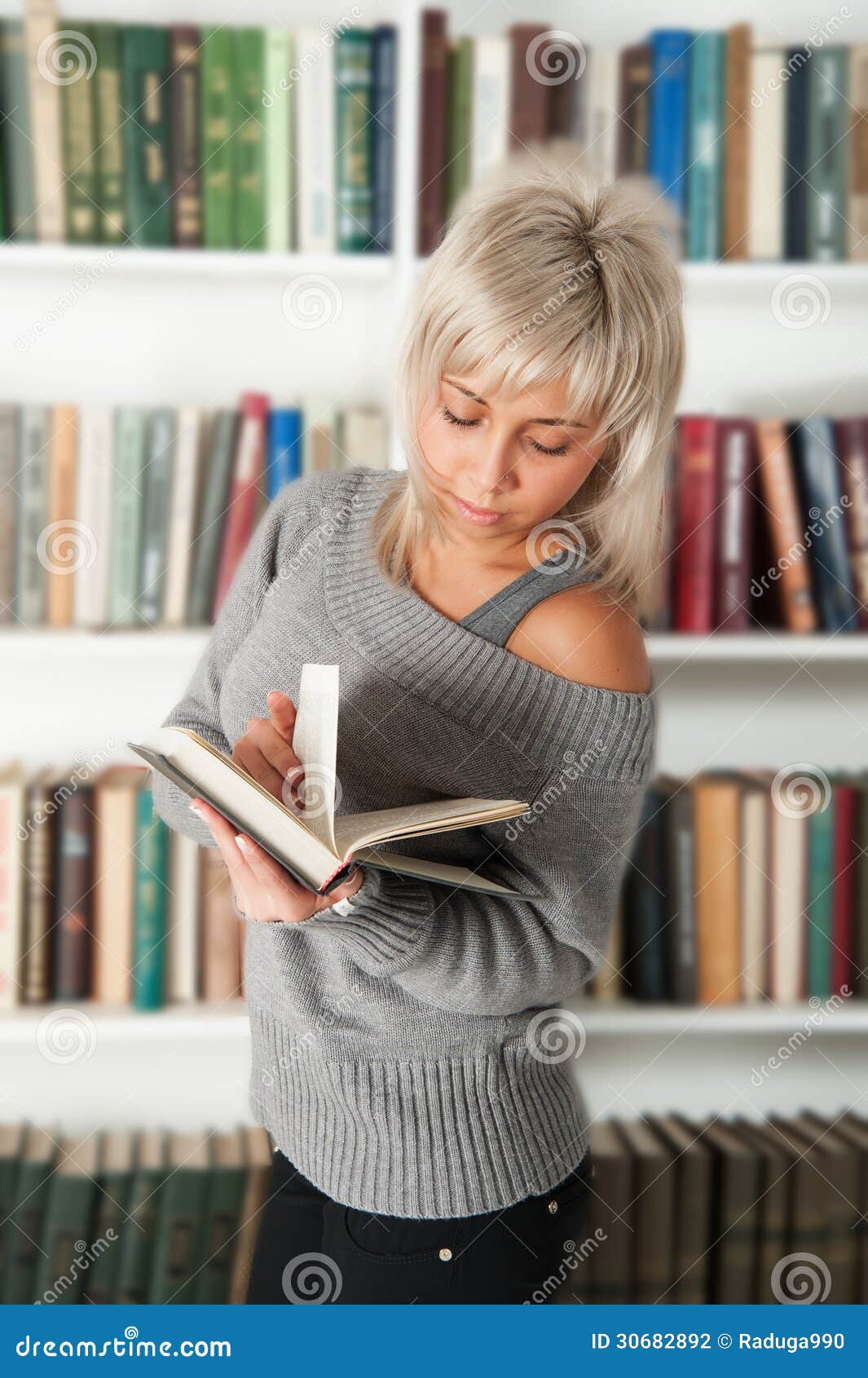 Woman Standing at Bookshelf Stock Photo - Image of woman, university ...