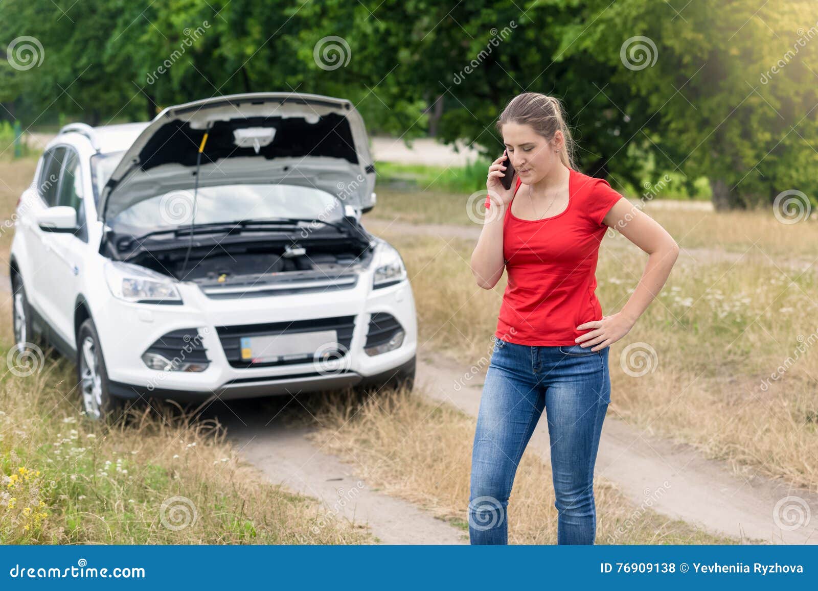 Woman Standing at Broken Car on Rural Road and Calling on Cellphone for ...