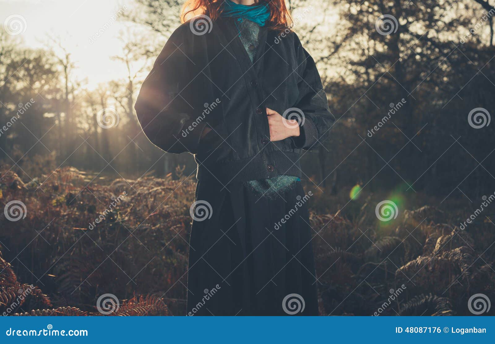 Woman Standing in the Forest at Sunset Stock Photo - Image of ...