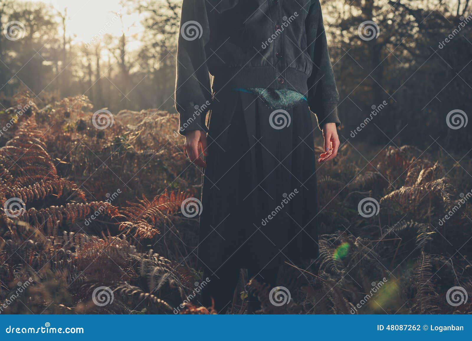 Woman Standing in the Forest at Sunset Stock Photo - Image of people ...