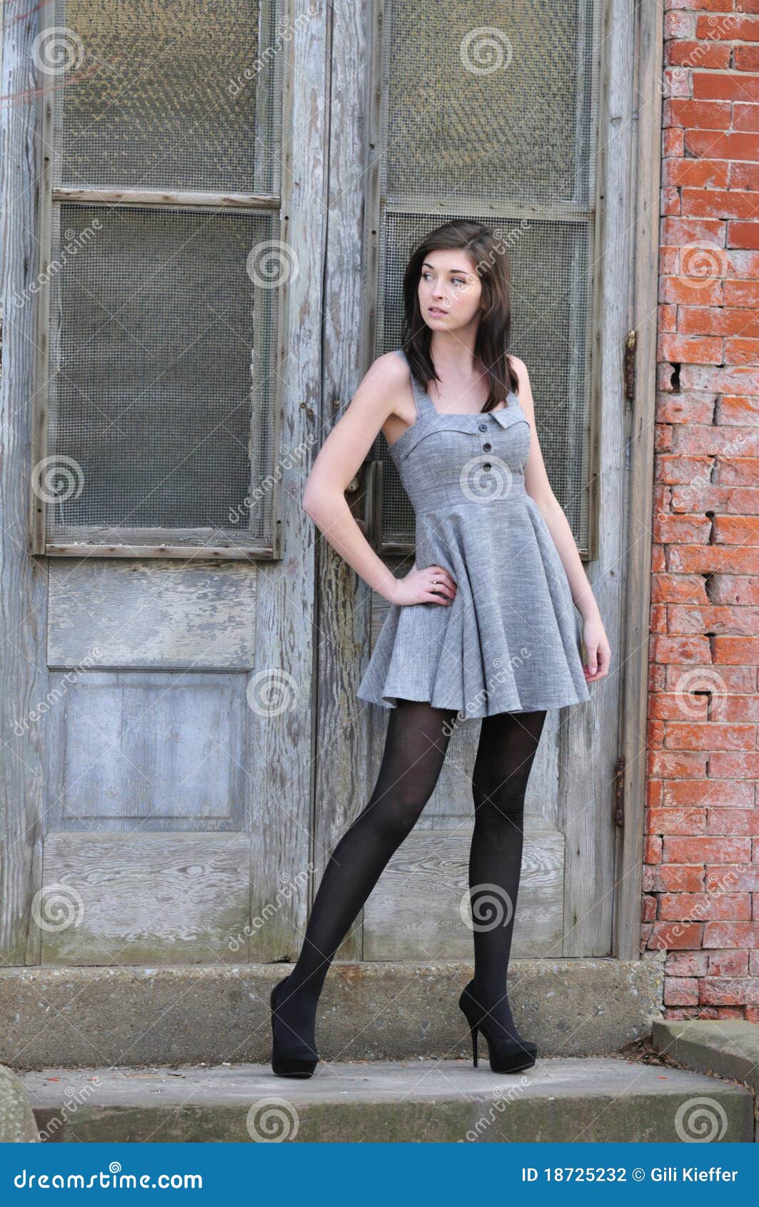 Woman Standing at the Front Door Stock Photo - Image of texture, posing ...