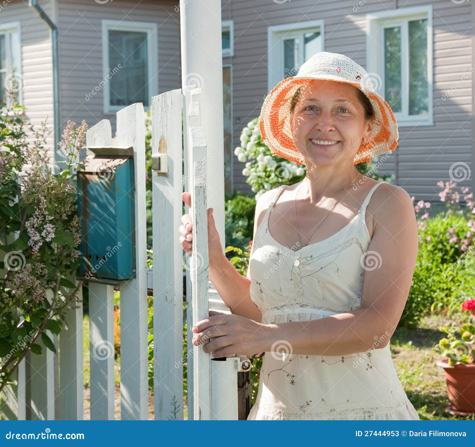 Woman Standing at the Gate of a Country House Stock Image - Image of ...