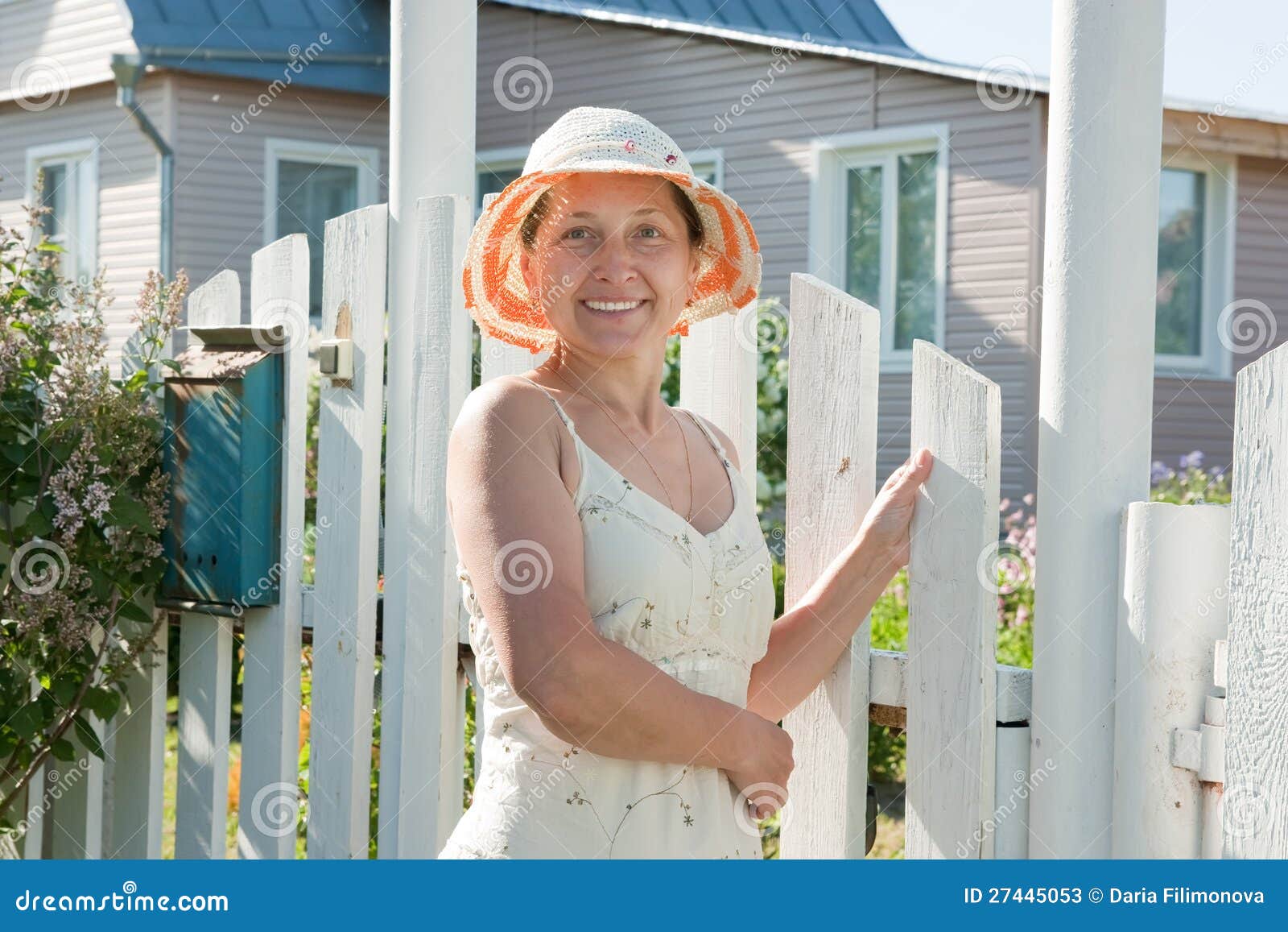 Woman Standing at the Gate of House Stock Image - Image of 4050 ...
