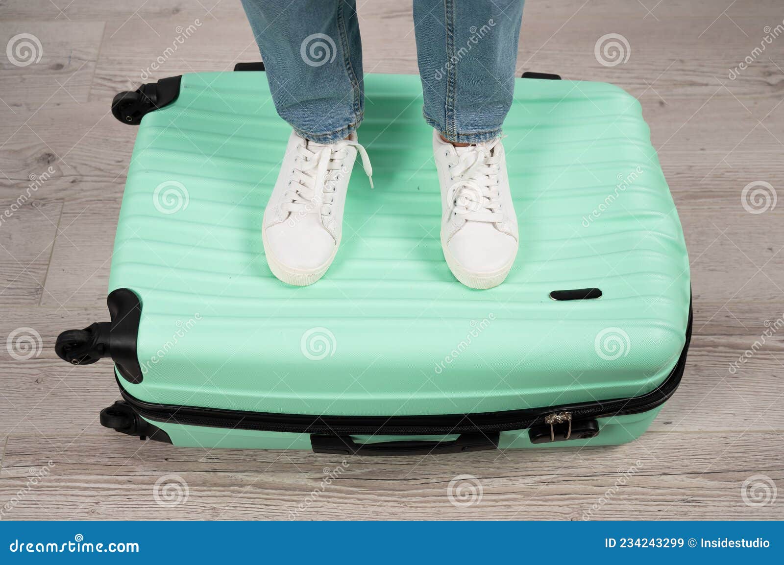 Woman Standing with Her Feet on a Suitcase. Stock Image - Image of ...
