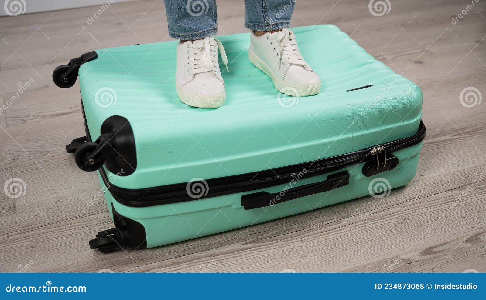 Woman Standing with Her Feet on a Suitcase. Stock Photo - Image of ...