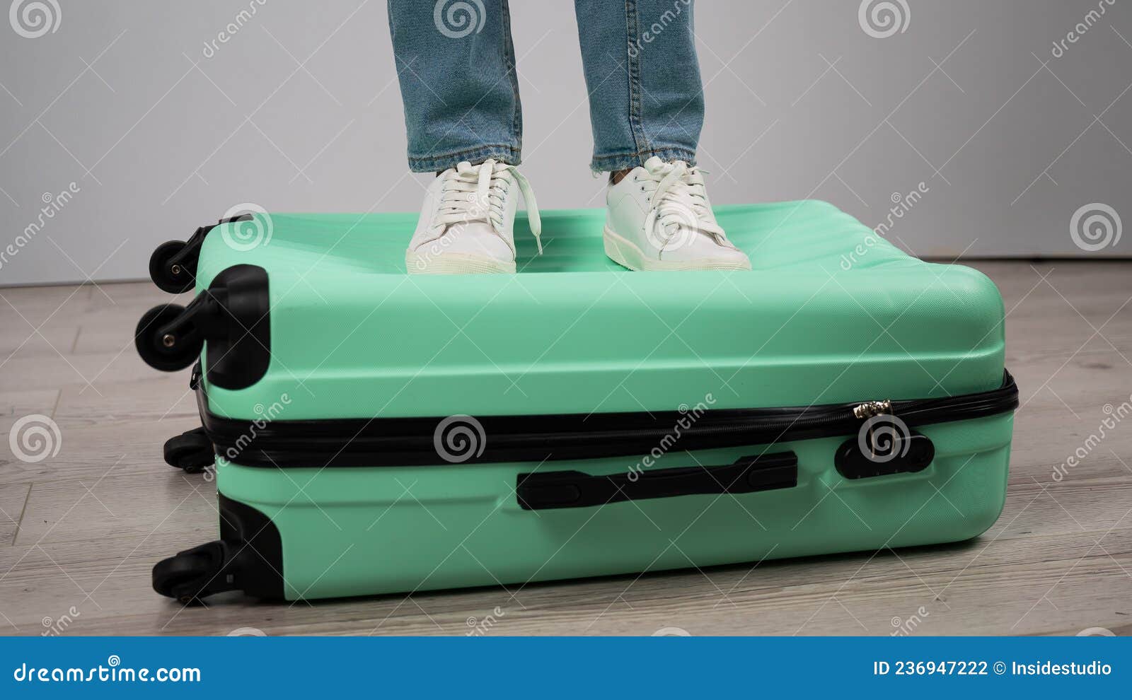 Woman Standing with Her Feet on a Suitcase. Stock Photo - Image of foot ...