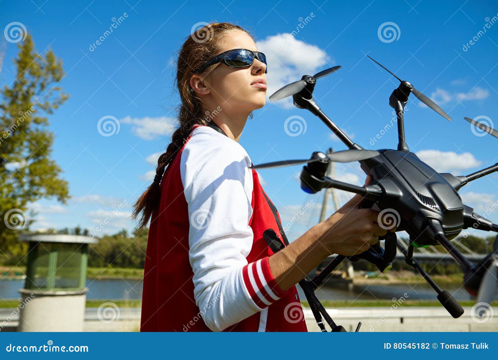 Woman is Standing and Holding Drone Stock Photo - Image of starting ...