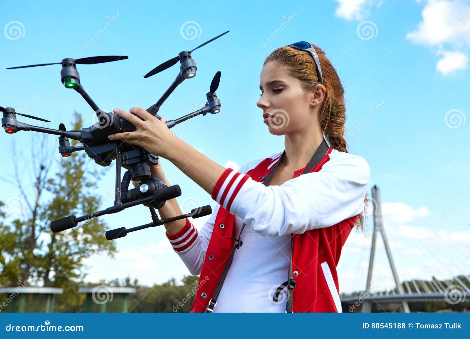 Woman is Standing and Holding Drone Stock Photo - Image of multi, radio ...