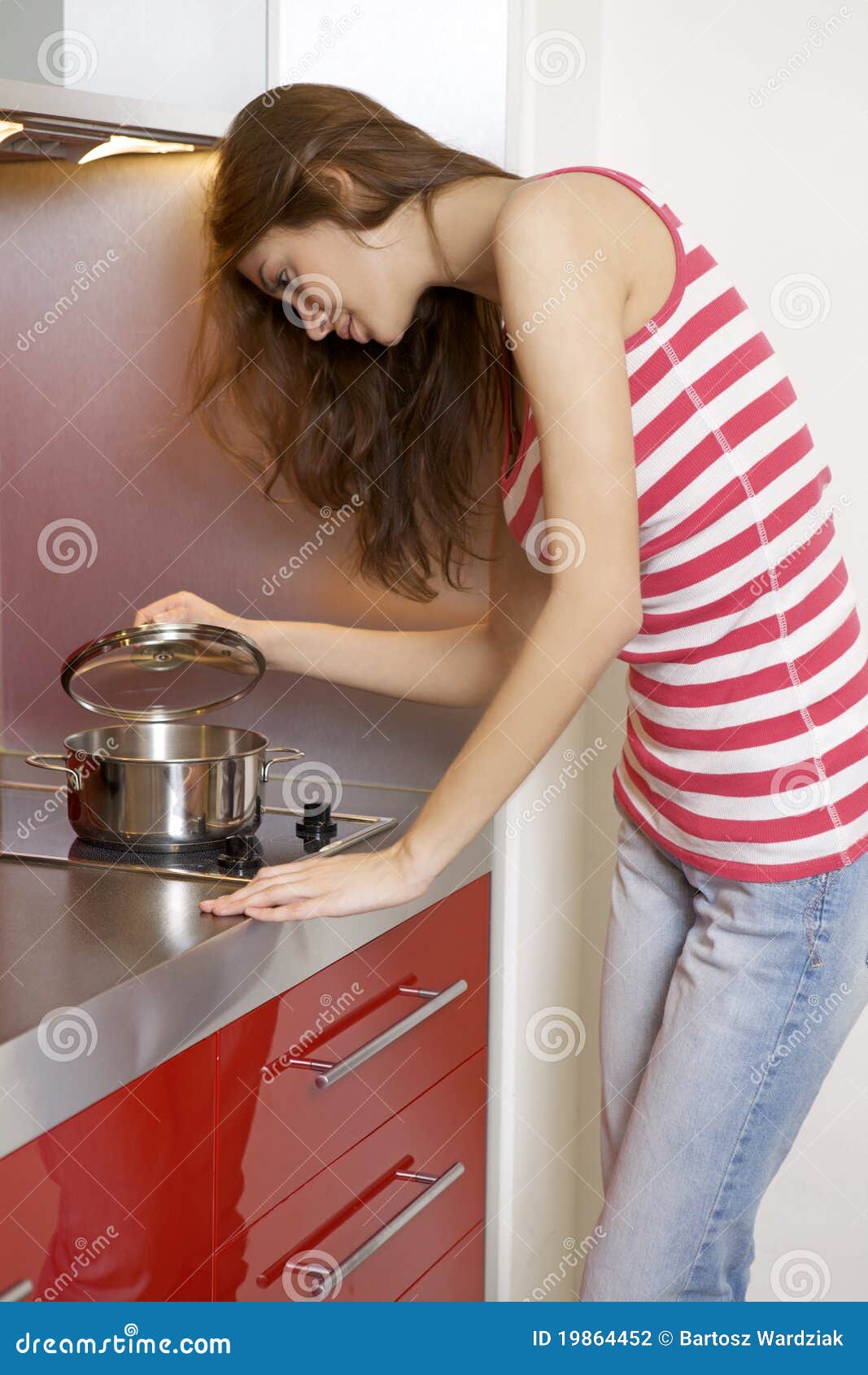 Woman Standing at the Kitchen Stock Photo - Image of house, hand: 19864452