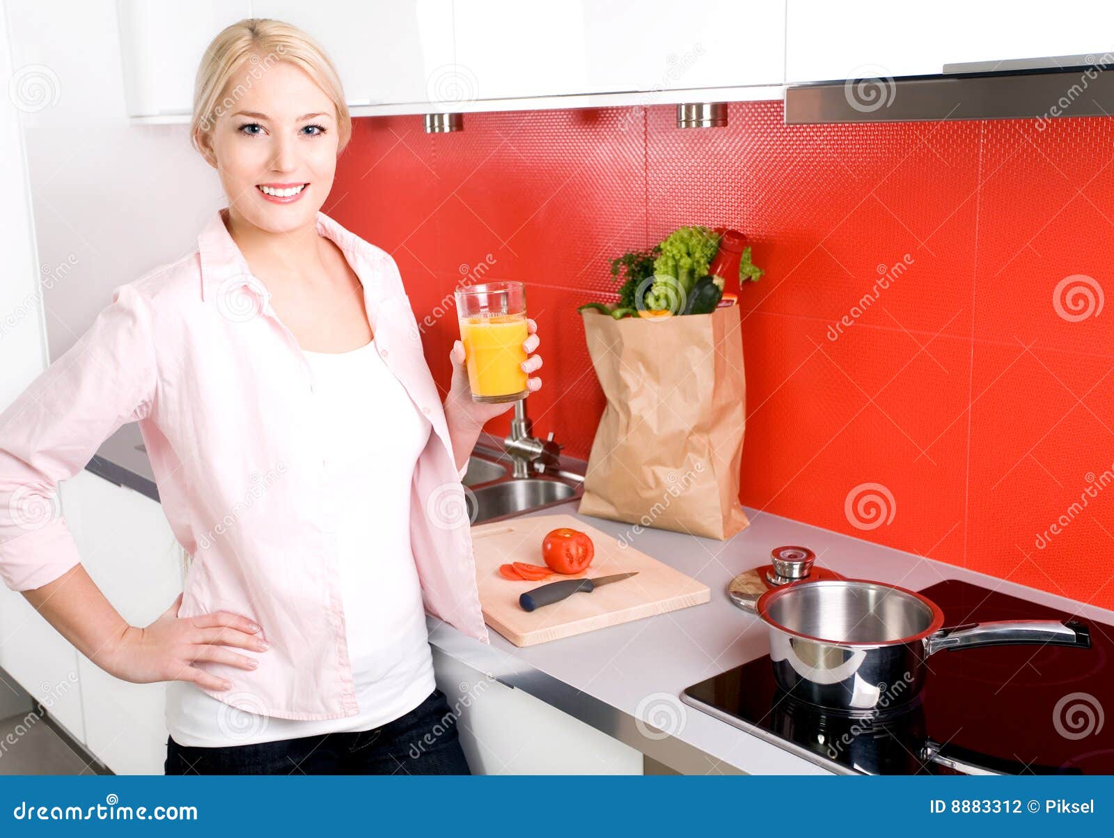 Woman standing in kitchen stock photo. Image of domestic - 8883312