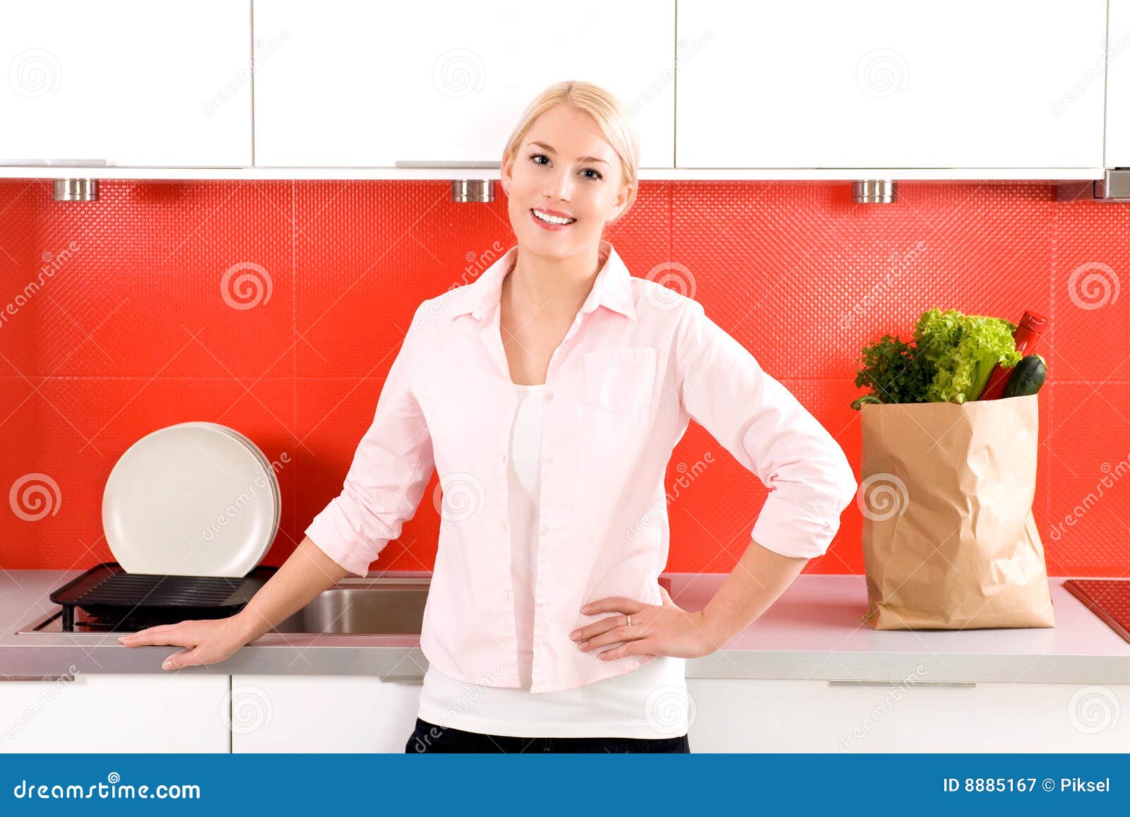 Woman standing in kitchen stock image. Image of interior - 8885167