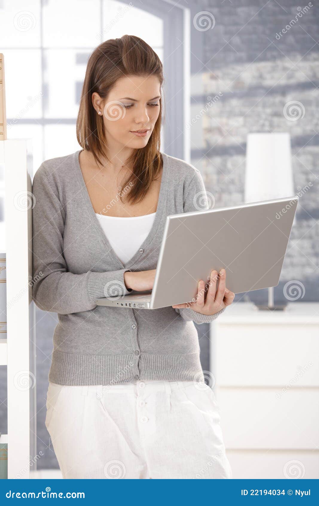 Woman Standing with Laptop at Home Stock Photo - Image of computer ...