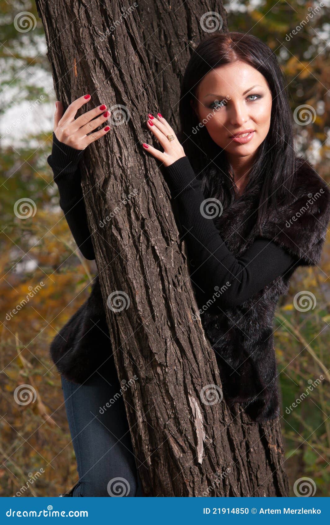Woman standing near a tree stock photo. Image of lips - 21914850