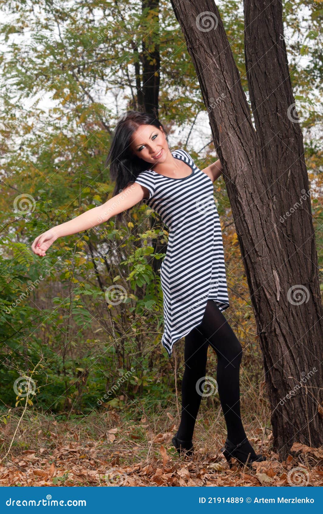 Woman standing near a tree stock image. Image of leaves - 21914889