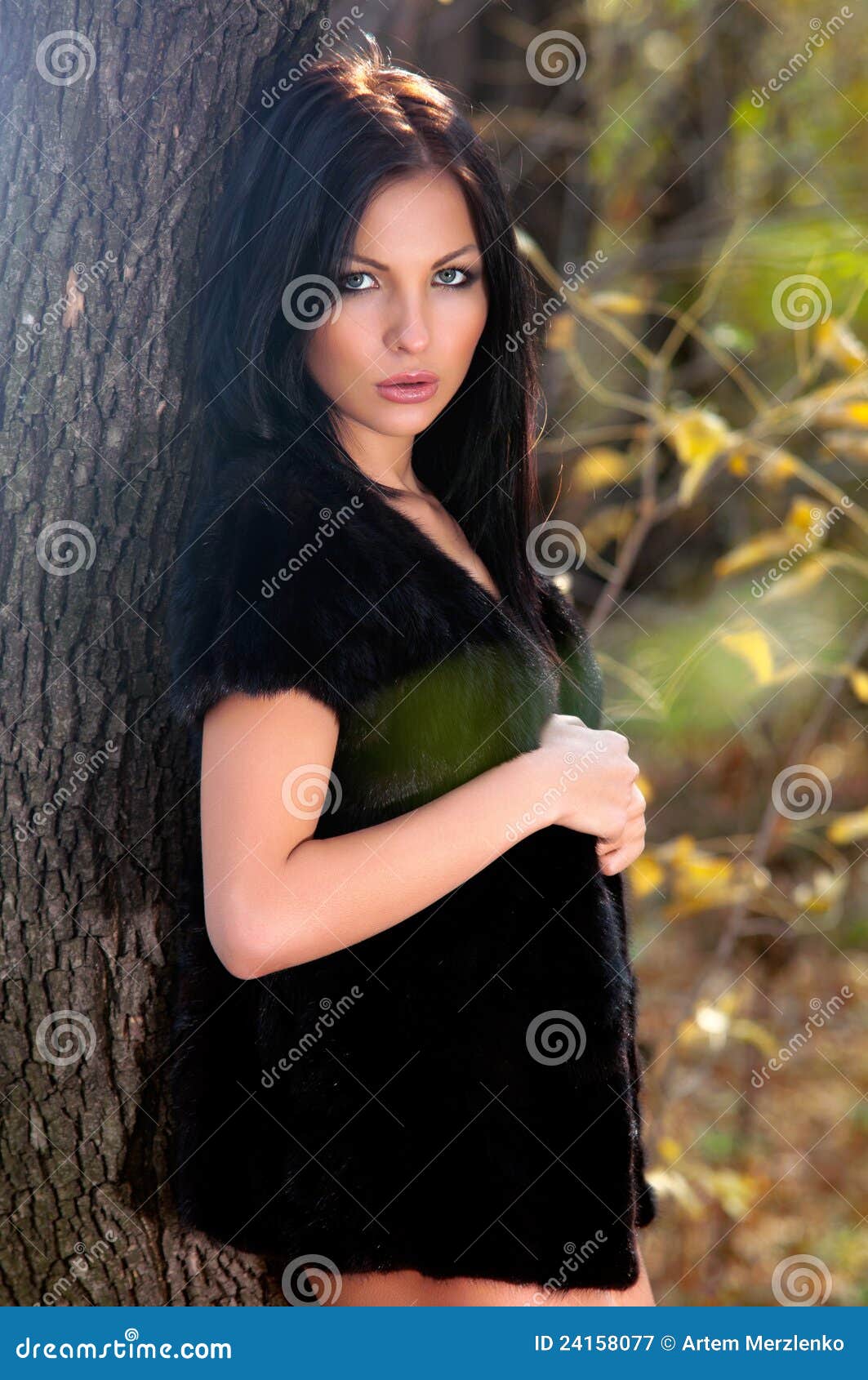 Woman standing near a tree stock image. Image of mood - 24158077