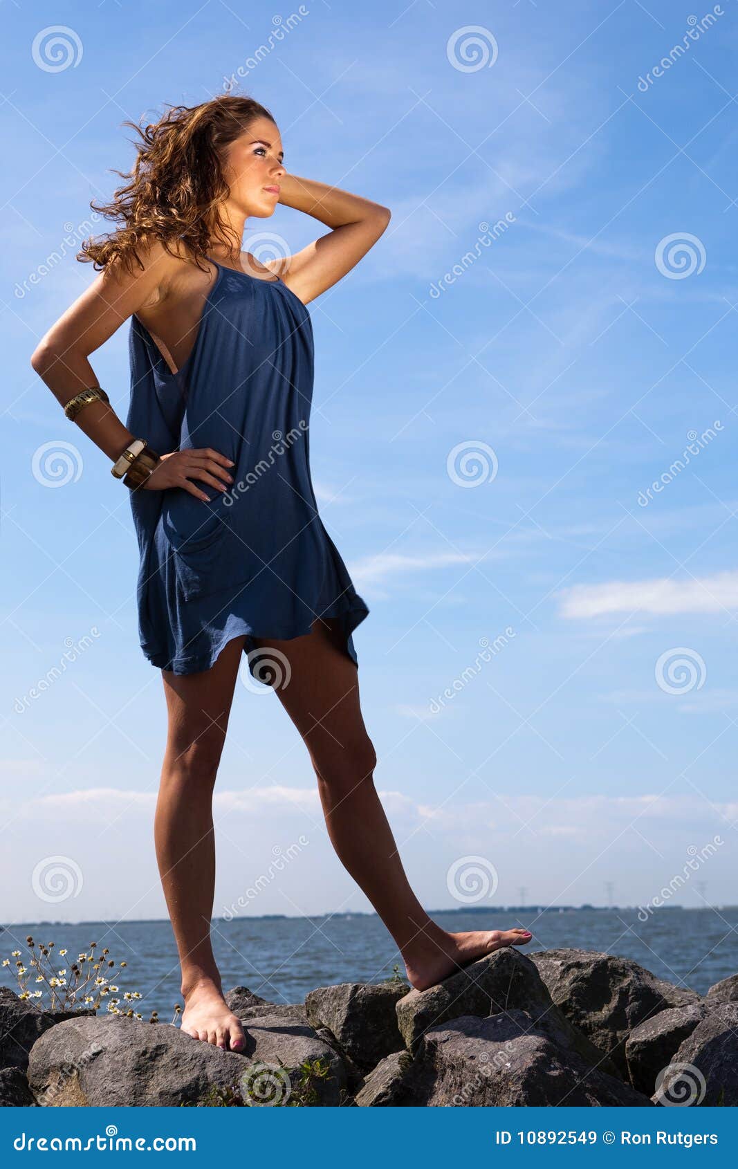 Woman standing by ocean stock image. Image of poses, outdoors - 10892549