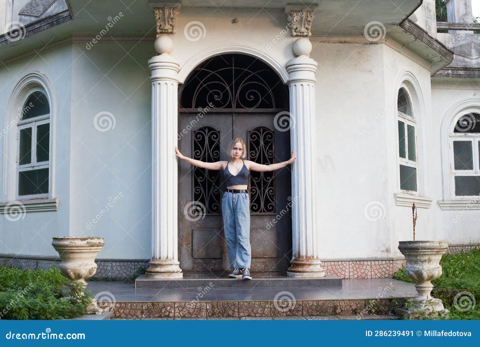 Woman Standing with Outstretched Hands between Two Columns Stock Image ...