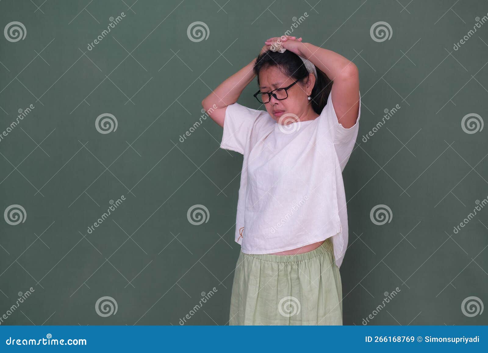 Woman Standing and Pressing Her Head with Both Hands Feeling Dizzy ...