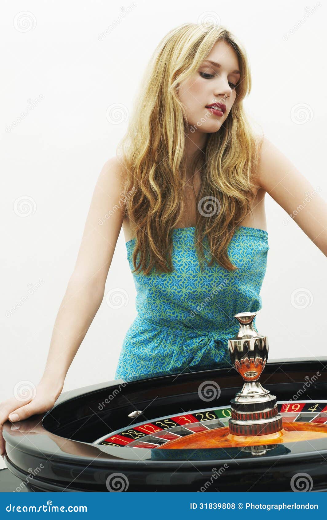 Woman Standing at Roulette Wheel Stock Photo - Image of glamour ...