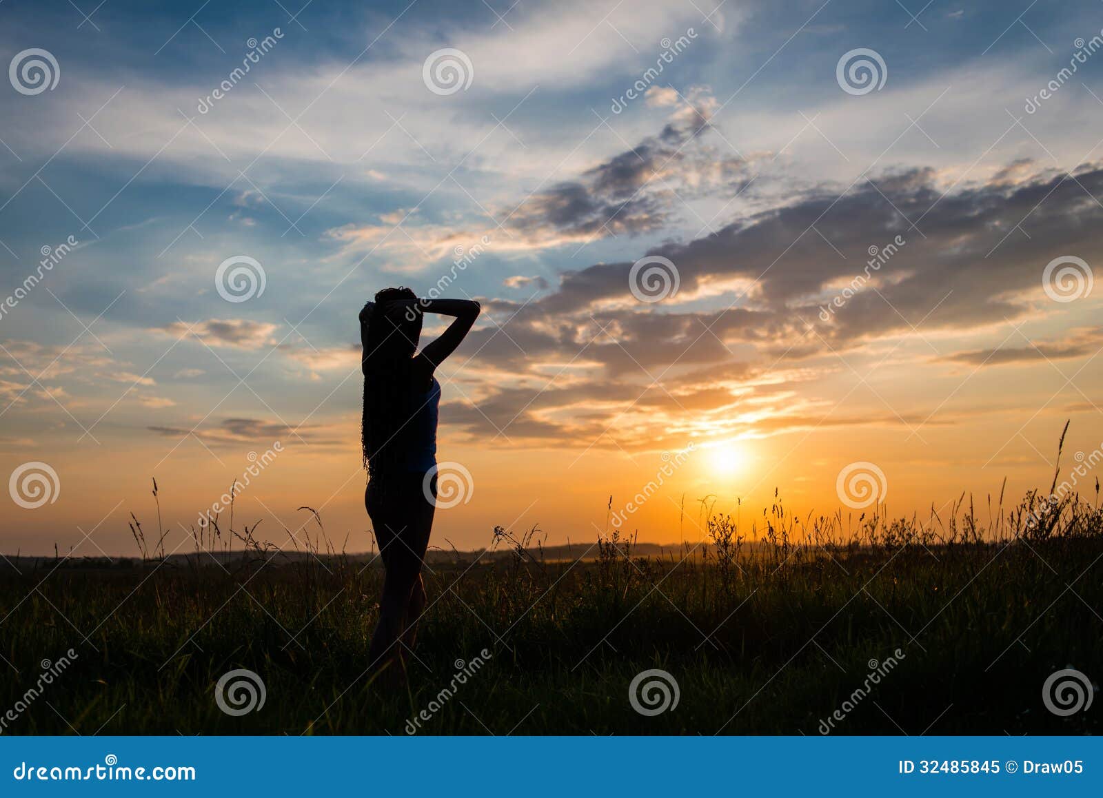 Woman standing at sunset stock image. Image of horizon - 32485845