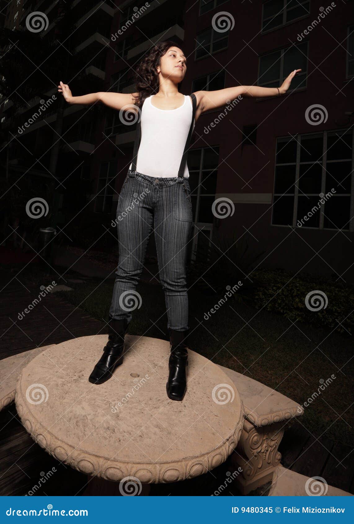 Woman standing on a table stock image. Image of female - 9480345