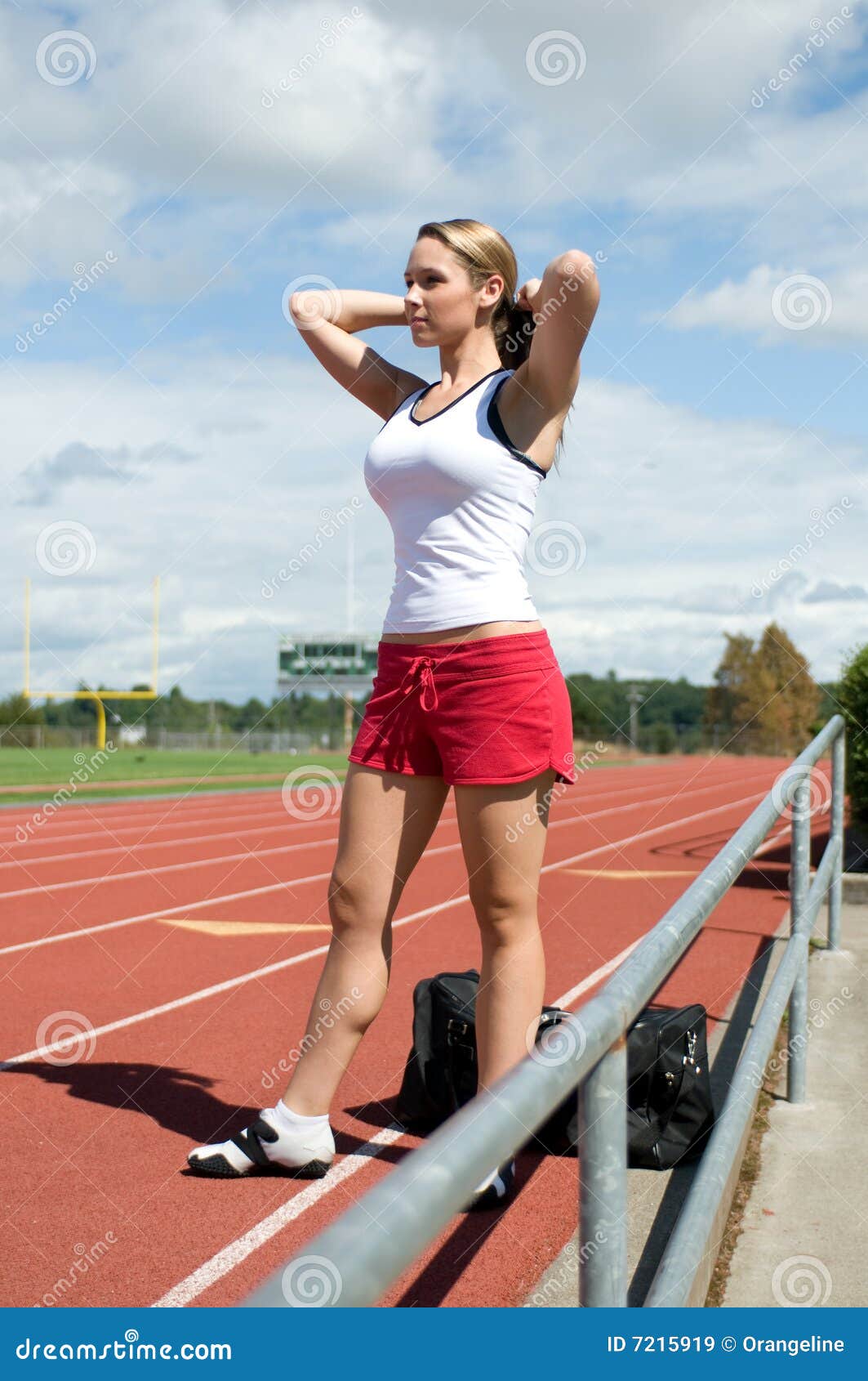 Woman Standing on a Track stock image. Image of female - 7215919
