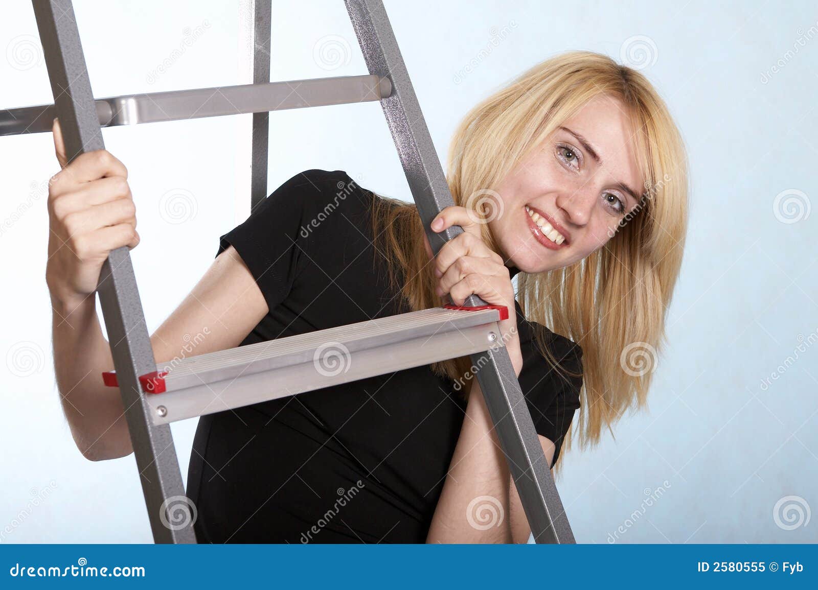 Woman Standing Under a Ladder Stock Image - Image of flirt, skirt: 2580555
