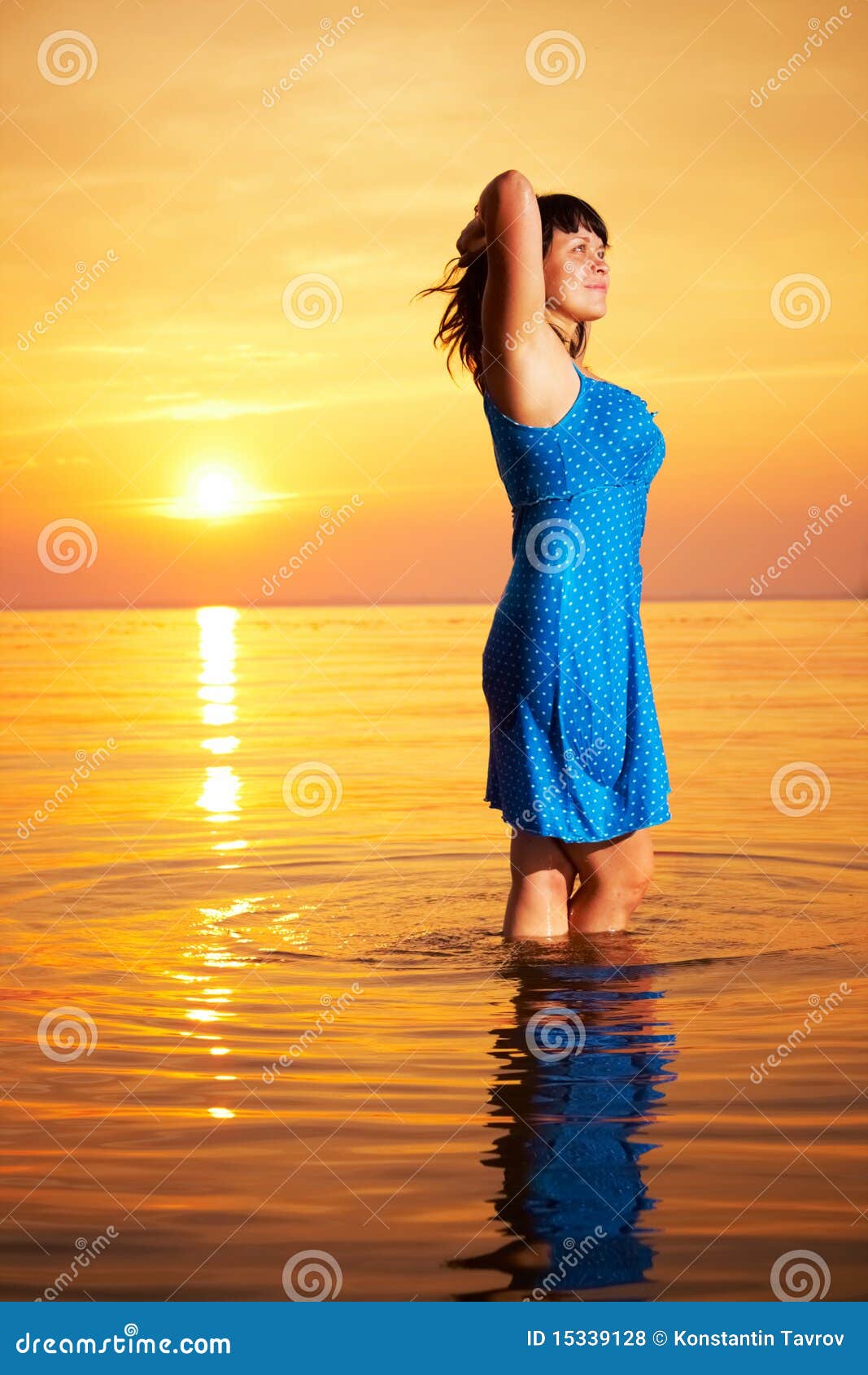 Woman standing in water stock photo. Image of people - 15339128