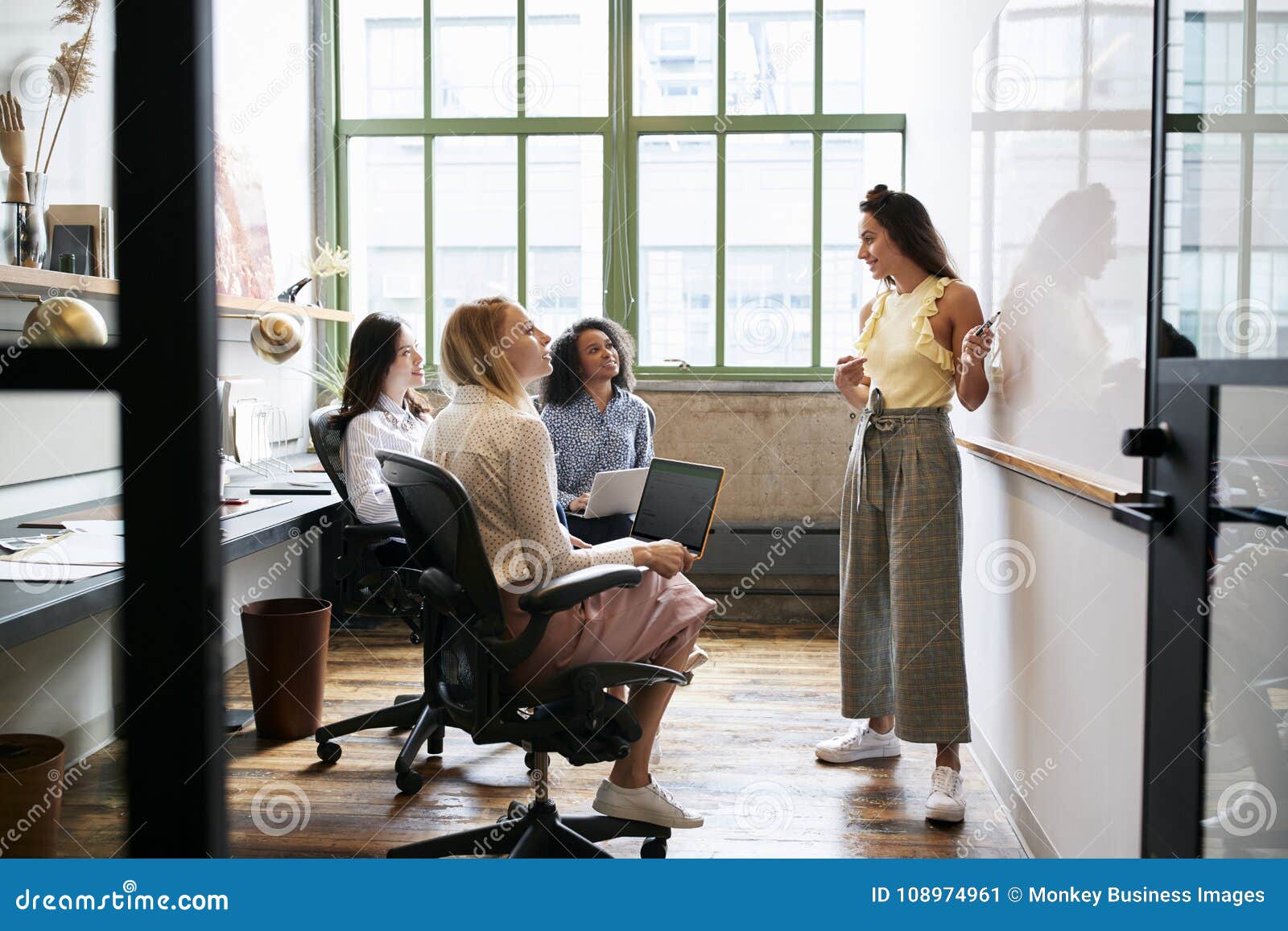 Woman Standing at Whiteboard in a Meeting with Female Team Stock Image ... Woman Standing at Whiteboard in a Meeting with Female Team Stock Image ...
