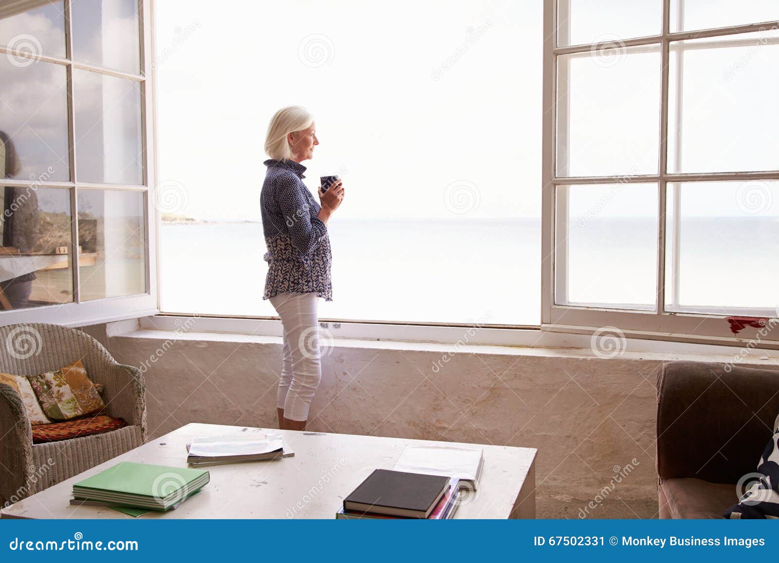 Woman Standing at Window and Looking at Beautiful Beach View Stock ...
