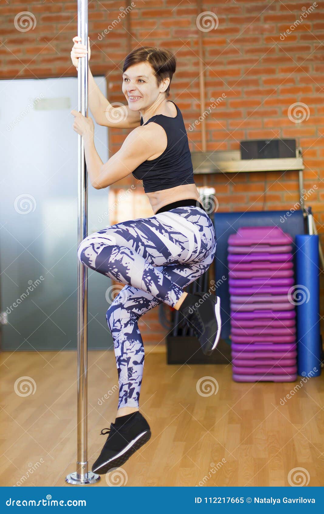 Woman Stands at the Pole in the Gym Stock Image - Image of poledance ...