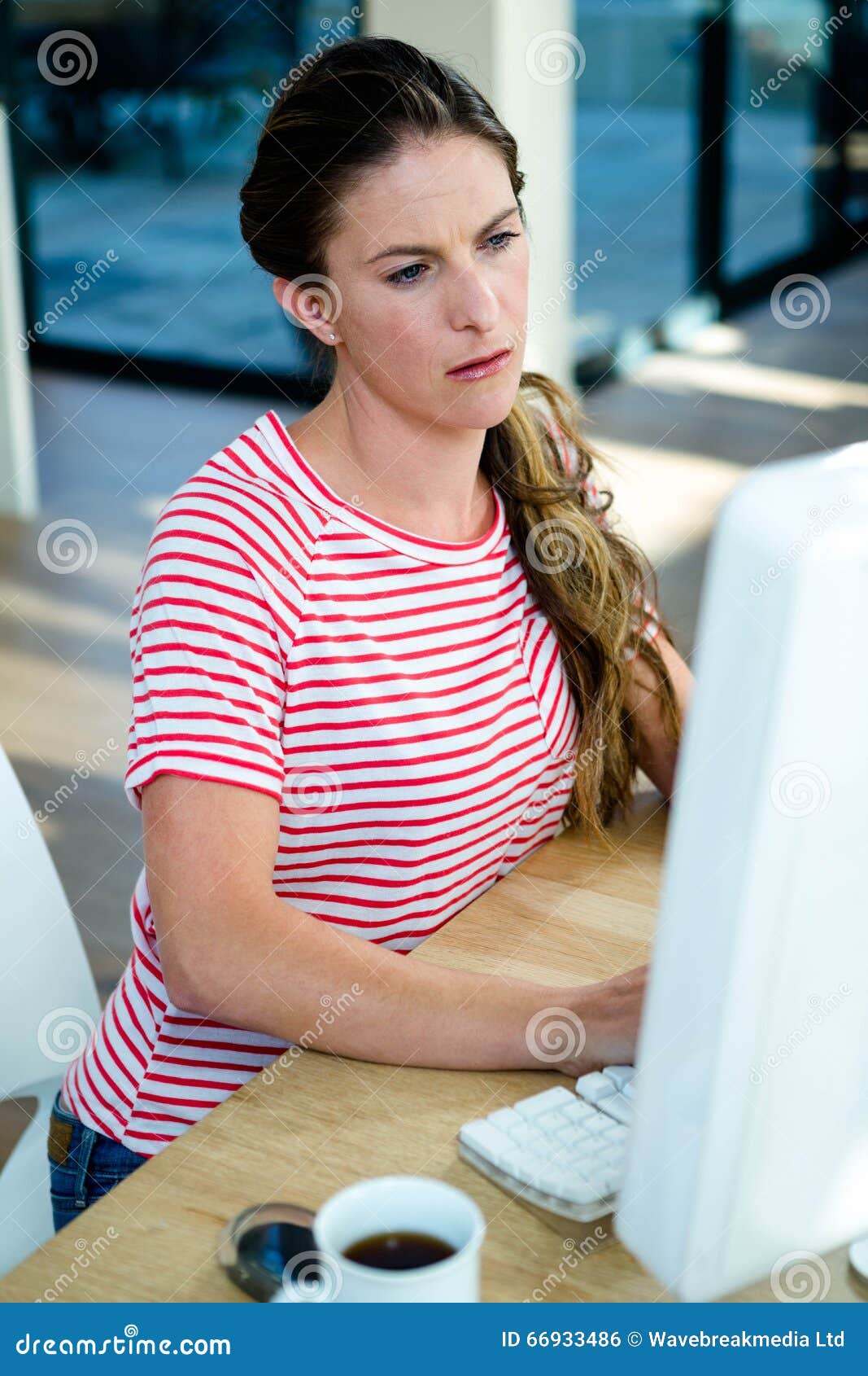 Woman Staring Intently at Her Computer Stock Photo - Image of swivel ...