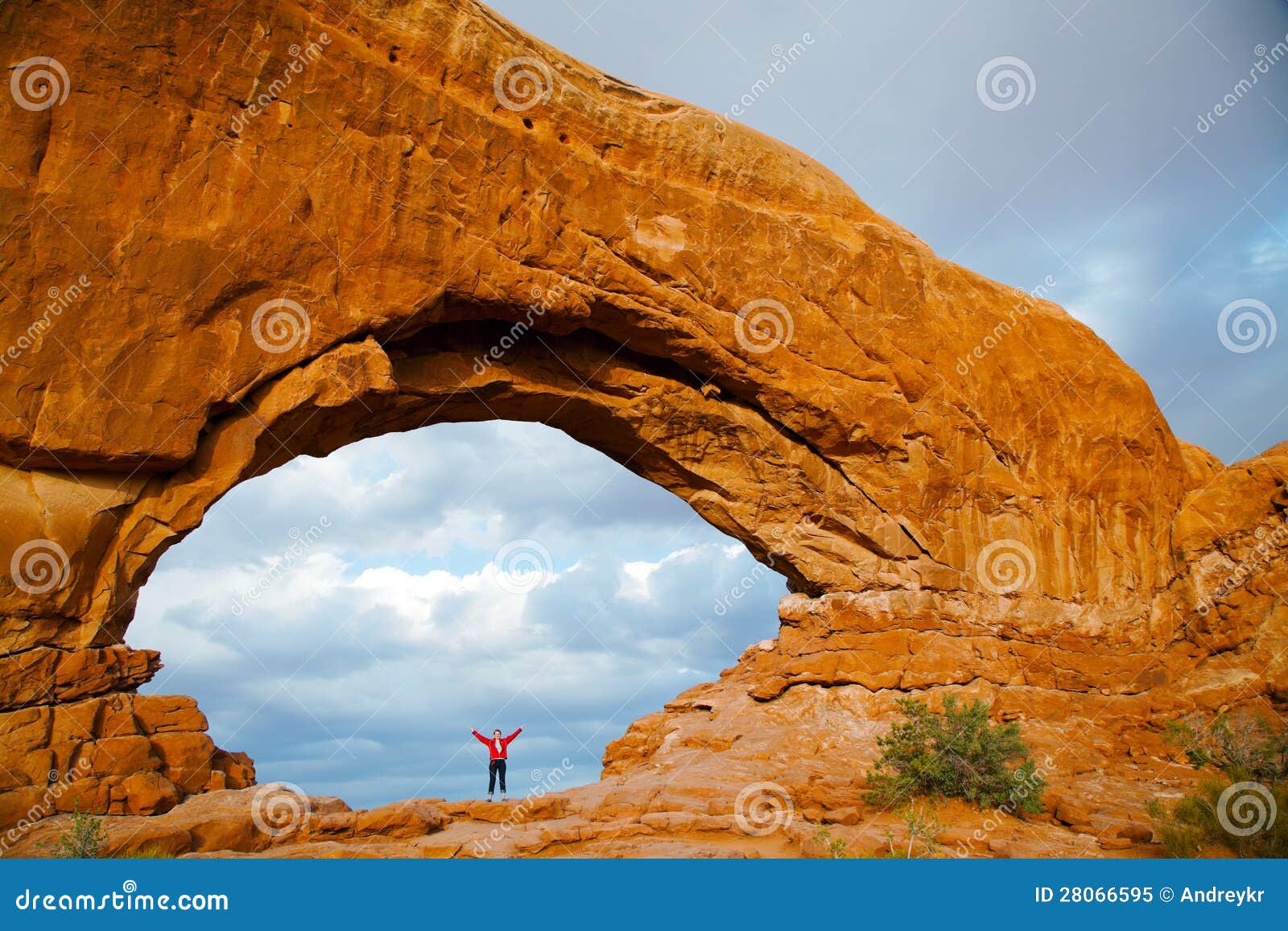 Woman Staying with Raised Hands Inside an Arch Stock Image - Image of ...
